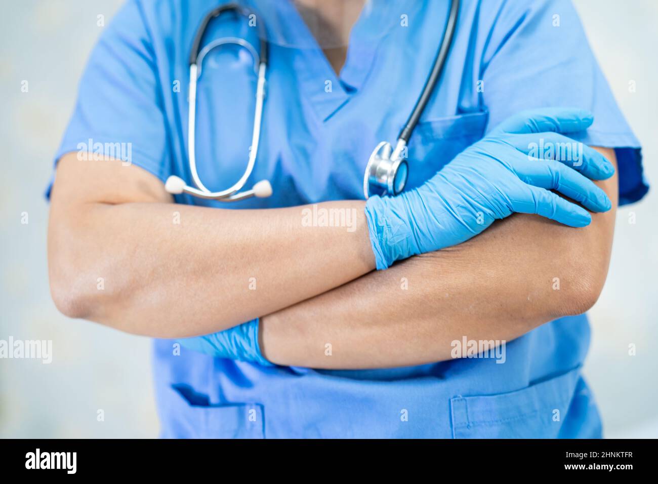 Asian doctor wearing PPE suit new normal to check patient protect ...