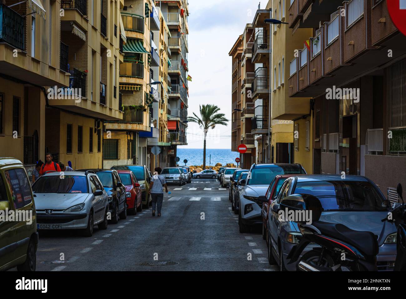 typical traditional Spanish street with houses and parked cars Stock ...