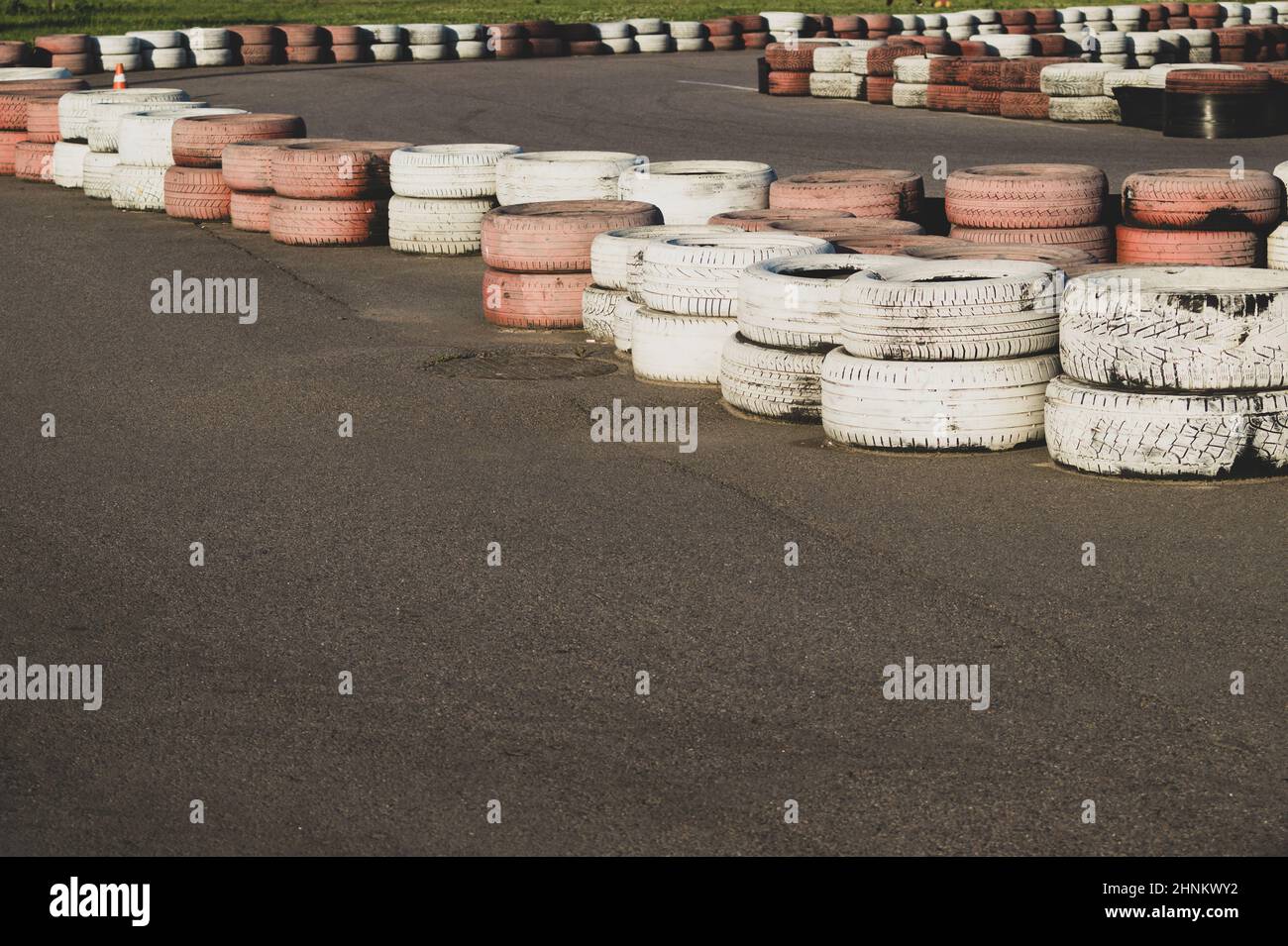 Race track safety barrier. asphalt racing track with red and white ...