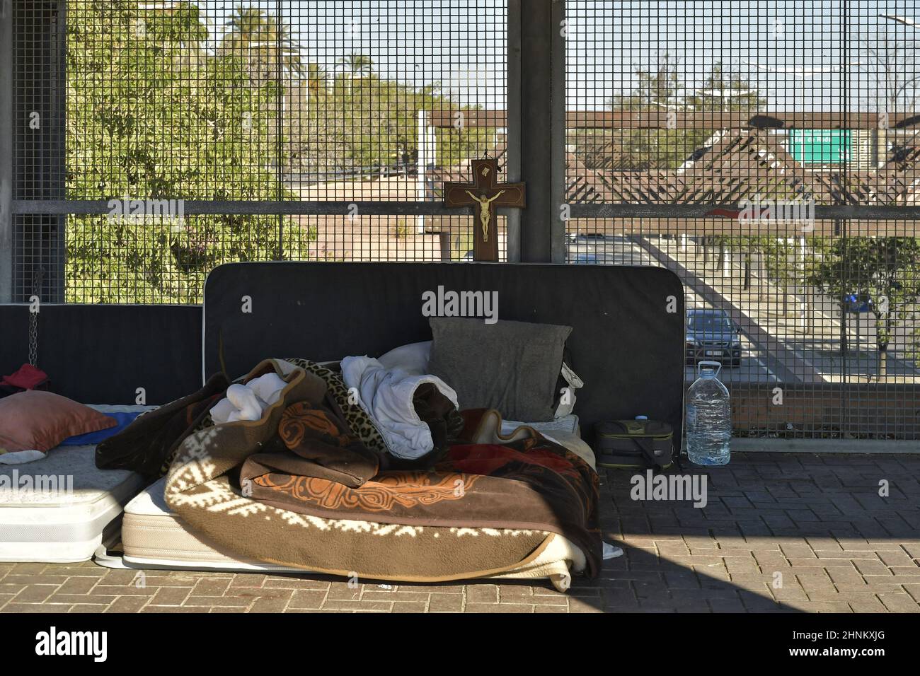 Homeless mattresses and blankets on the viaduct over highway in ...