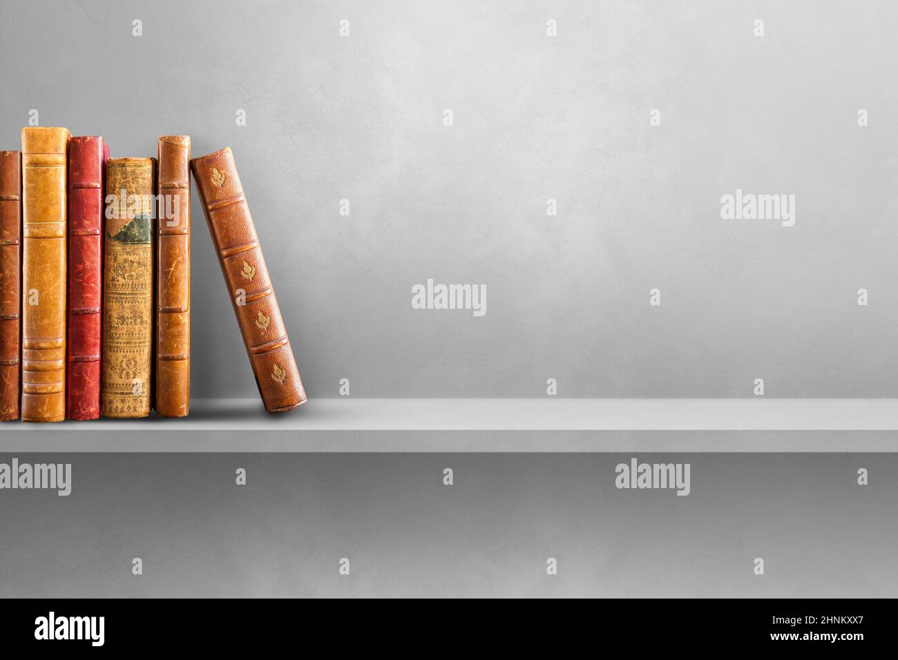 Row of old books on grey shelf. Horizontal background Stock Photo - Alamy