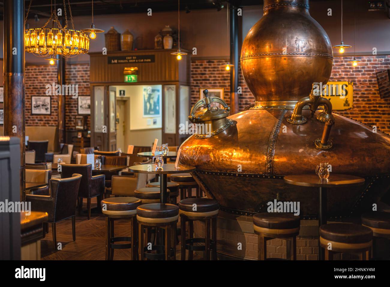 Large, copper fermentation vat in Bushmills whiskey distillery and bar ...