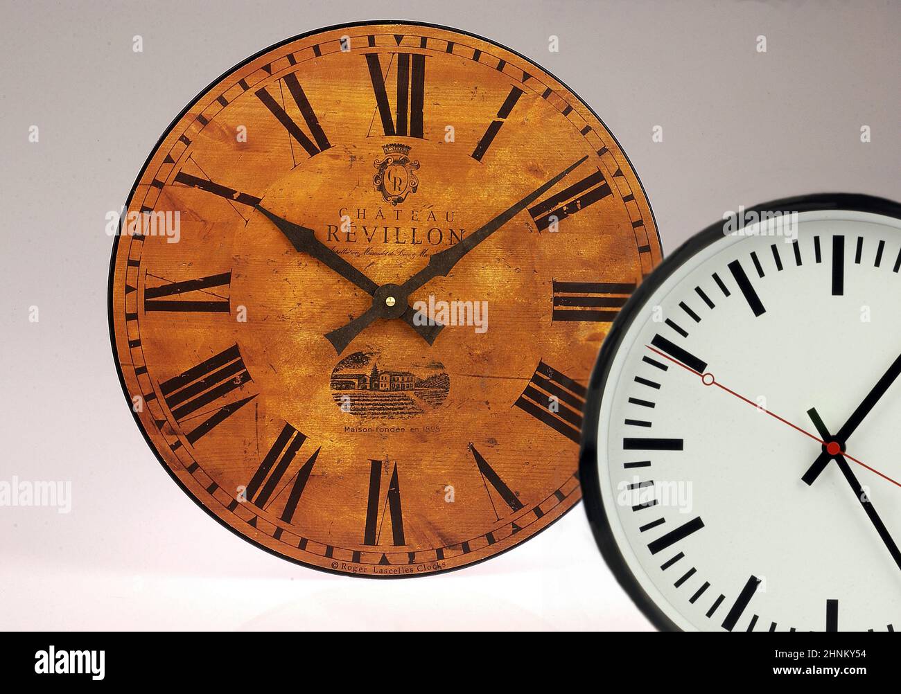 two wall clocks ,White background Stock Photo - Alamy