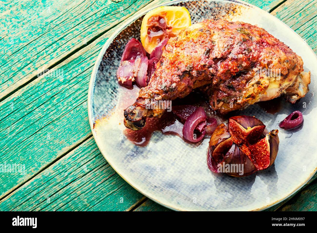 Chicken meat fried in fig fruit. Meat grilled with figs sauce Stock ...