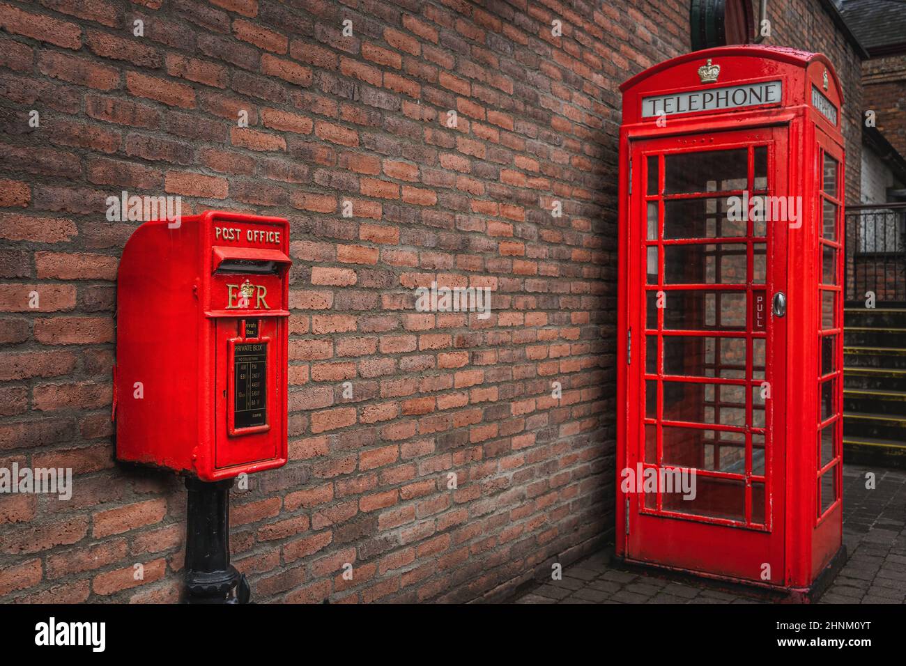The traditional British public red mailbox and telephone kiosk or booth ...