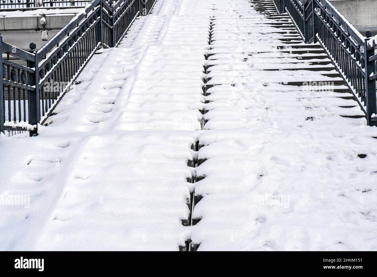 Stone stairs covered with snow after snowfall in winter. Extreme winter ...
