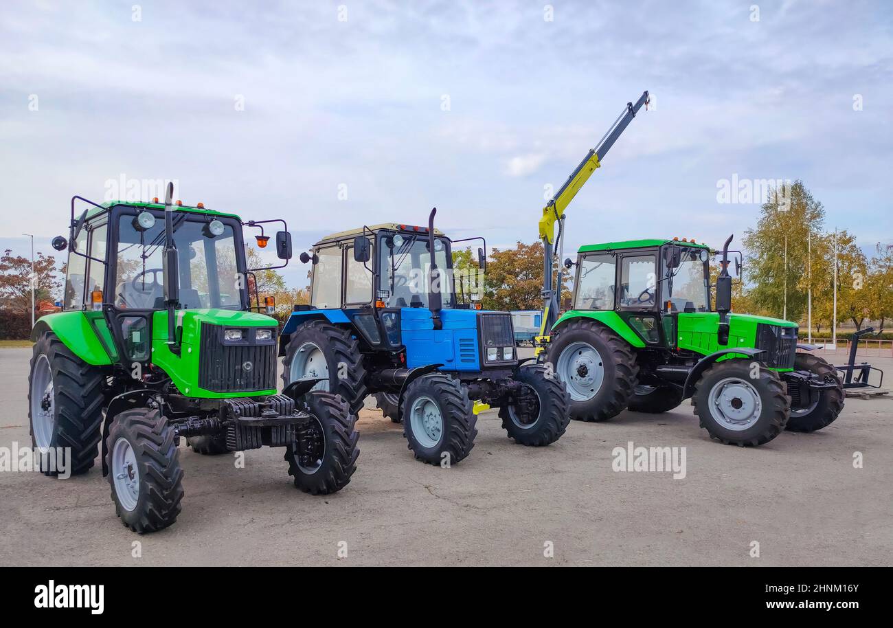 The colorful tractors in the road Stock Photo - Alamy