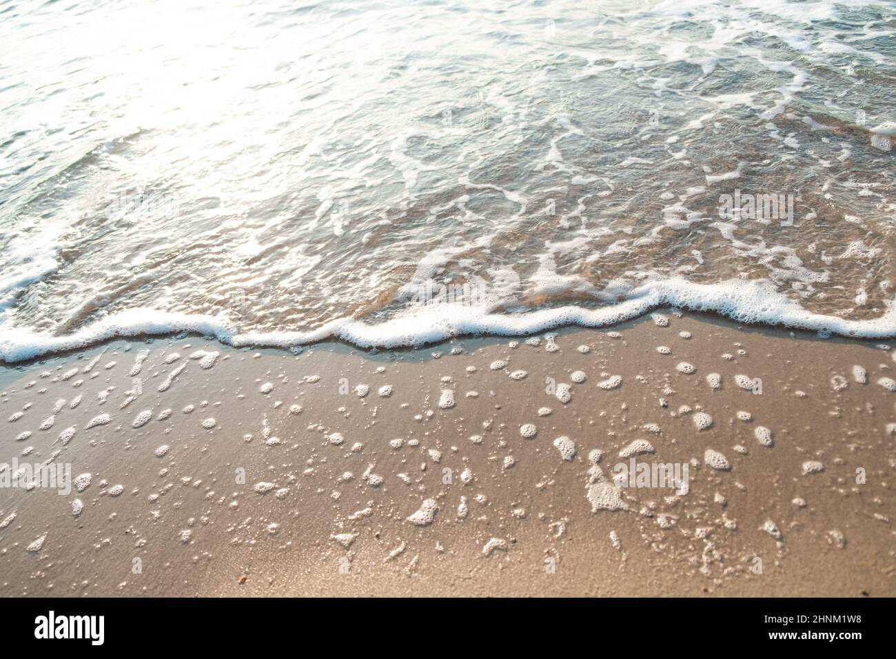 Close Up Wave Sand Beach Sea Foam. Closeup of sea wave with foam on ...