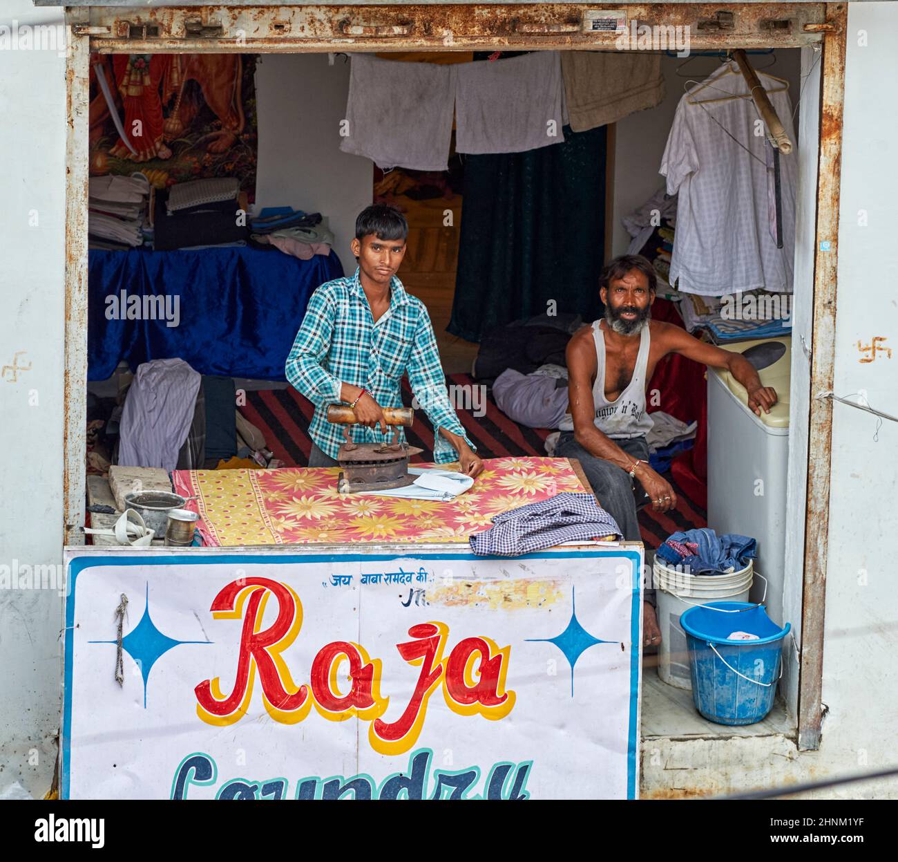 Ironing clothes india hi-res stock photography and images - Alamy