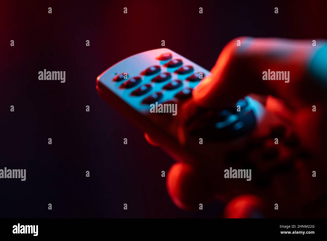 Hold remote control in hand 2 Stock Photo - Alamy