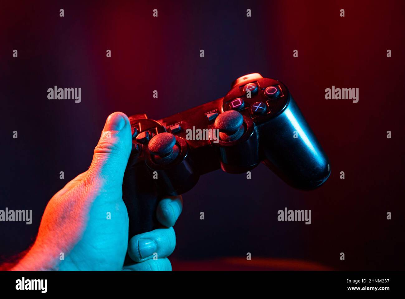 Joypad in hand Stock Photo - Alamy
