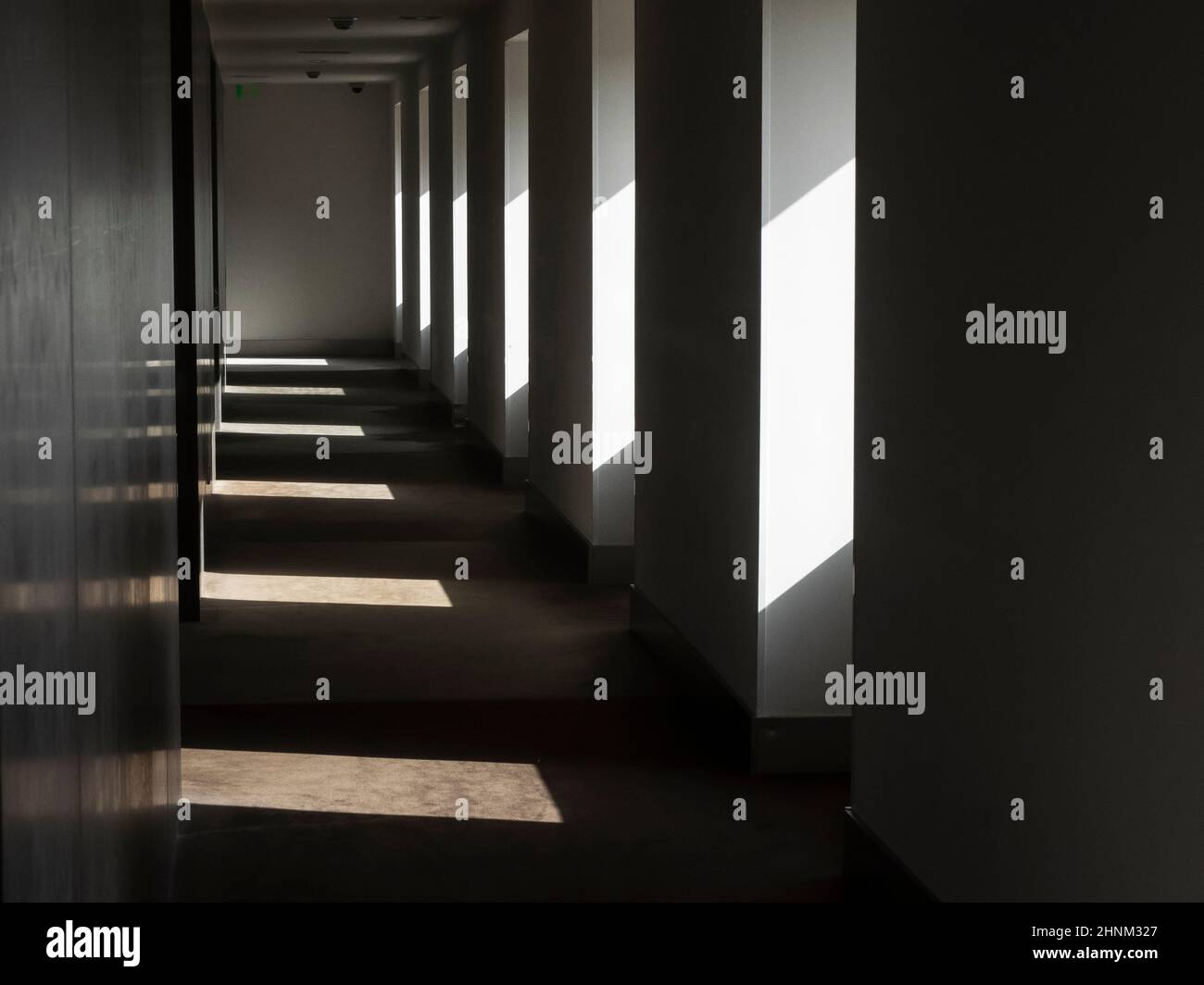 Contemporary straight lines in the windows through which the light ...