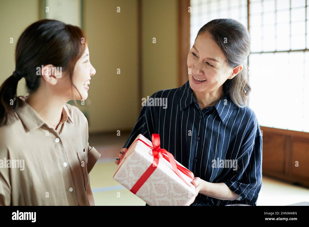 Old lady give tea hi-res stock photography and images - Alamy