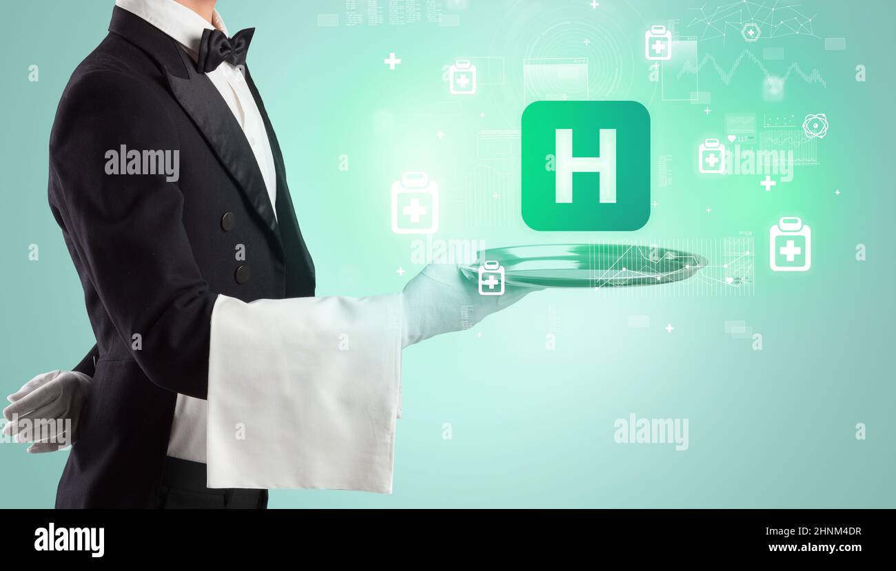 Handsome young waiter in tuxedo holding healthcare icons on tray Stock ...