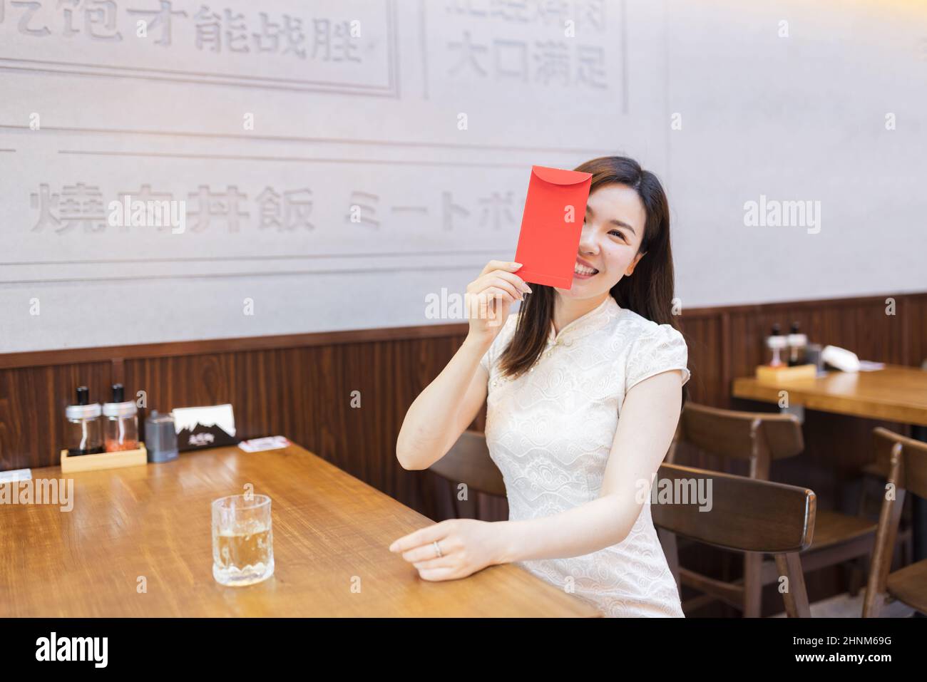 Beautiful young asian woman in traditional white dress named cheongsam ...