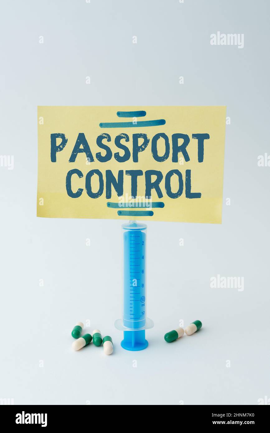 Text sign showing Passport Control, Word for the area in an airport ...