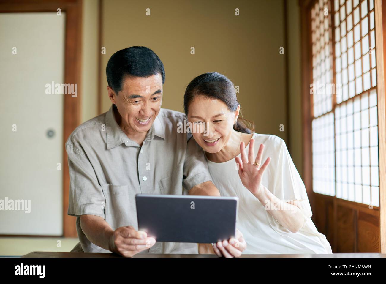 Happy asian family making video hi-res stock photography and images - Alamy