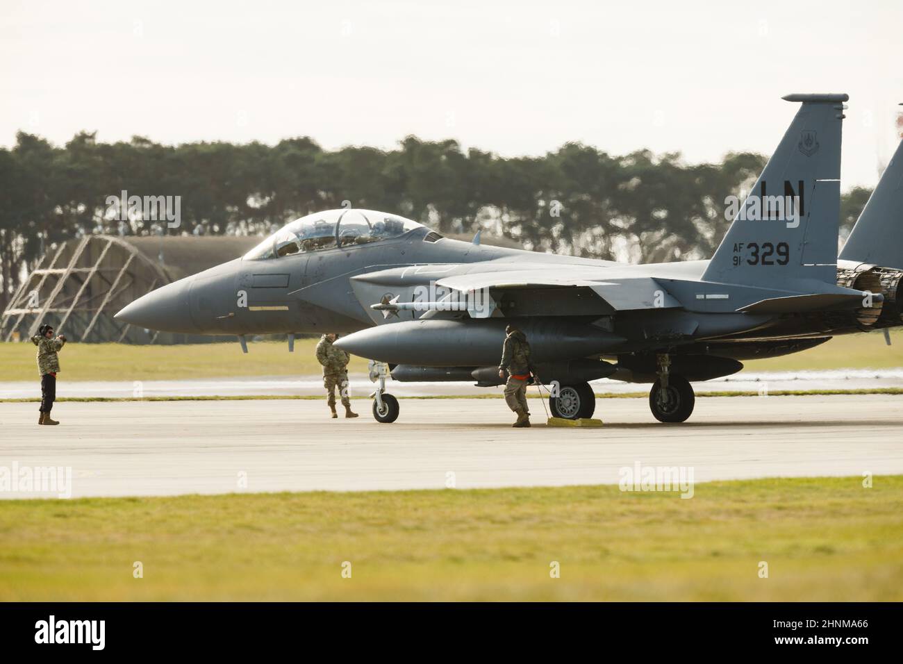 Ground crew prepare F15 fighters armed with weapons for take off from ...
