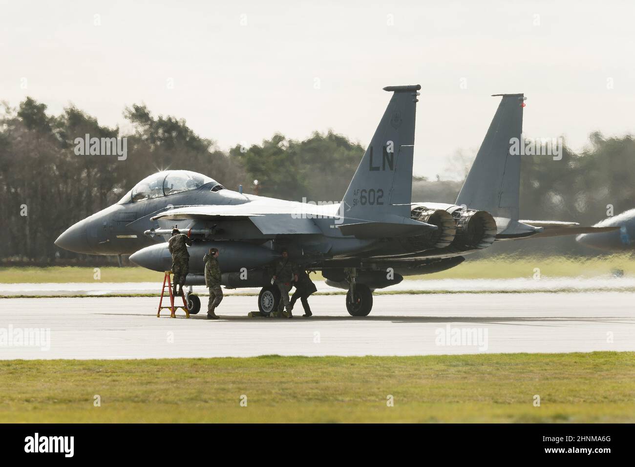 Ground crew prepare F15 fighters armed with weapons for take off from ...