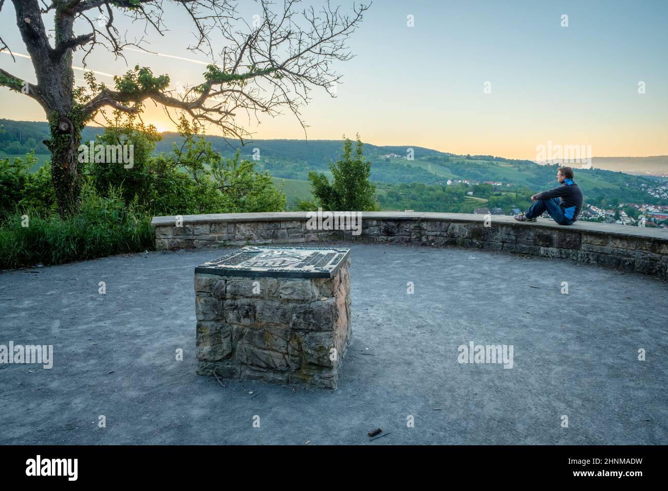 Man is sitting on a stone hi-res stock photography and images - Alamy