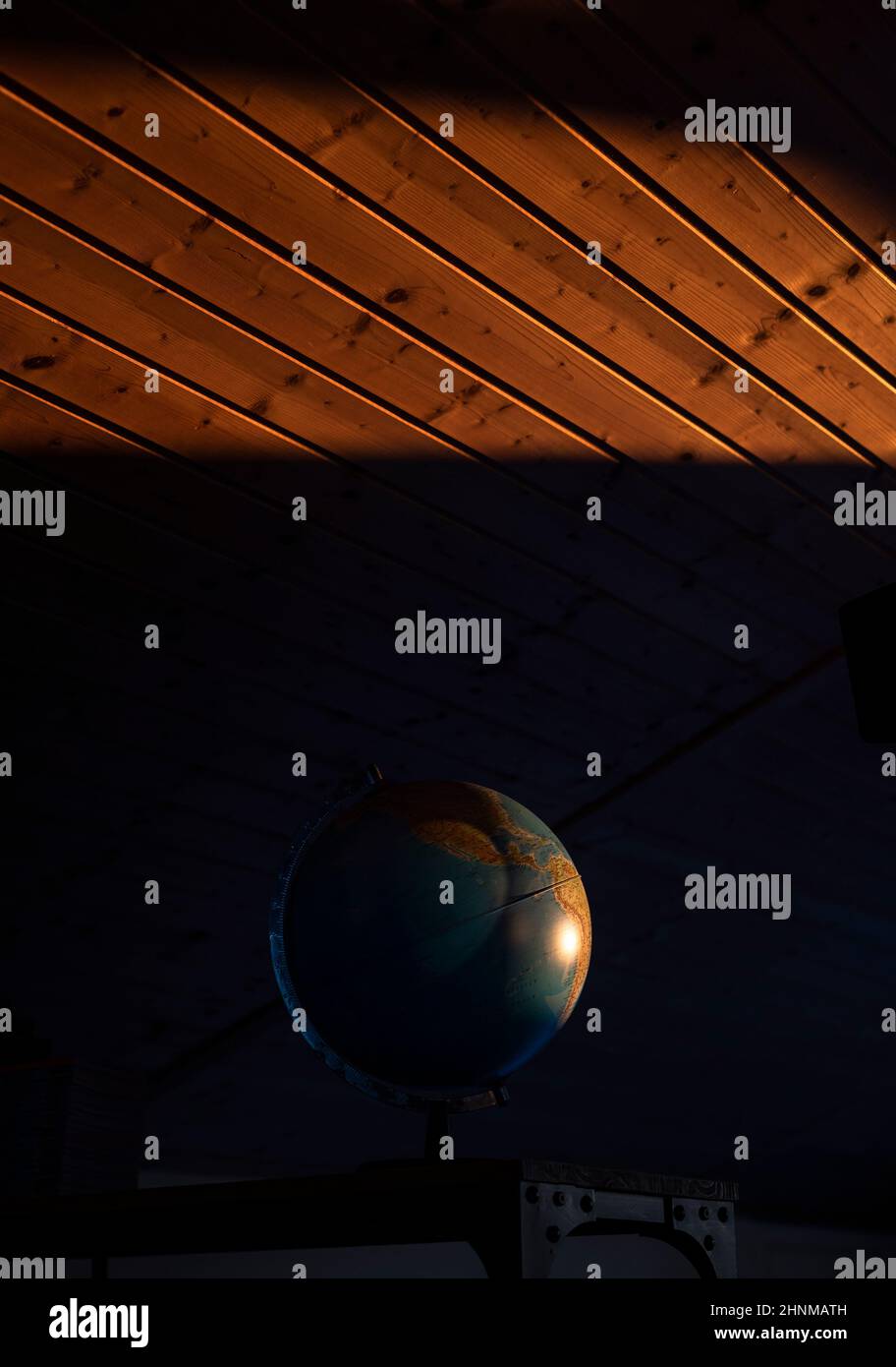 Globe illuminated by the sun Stock Photo - Alamy
