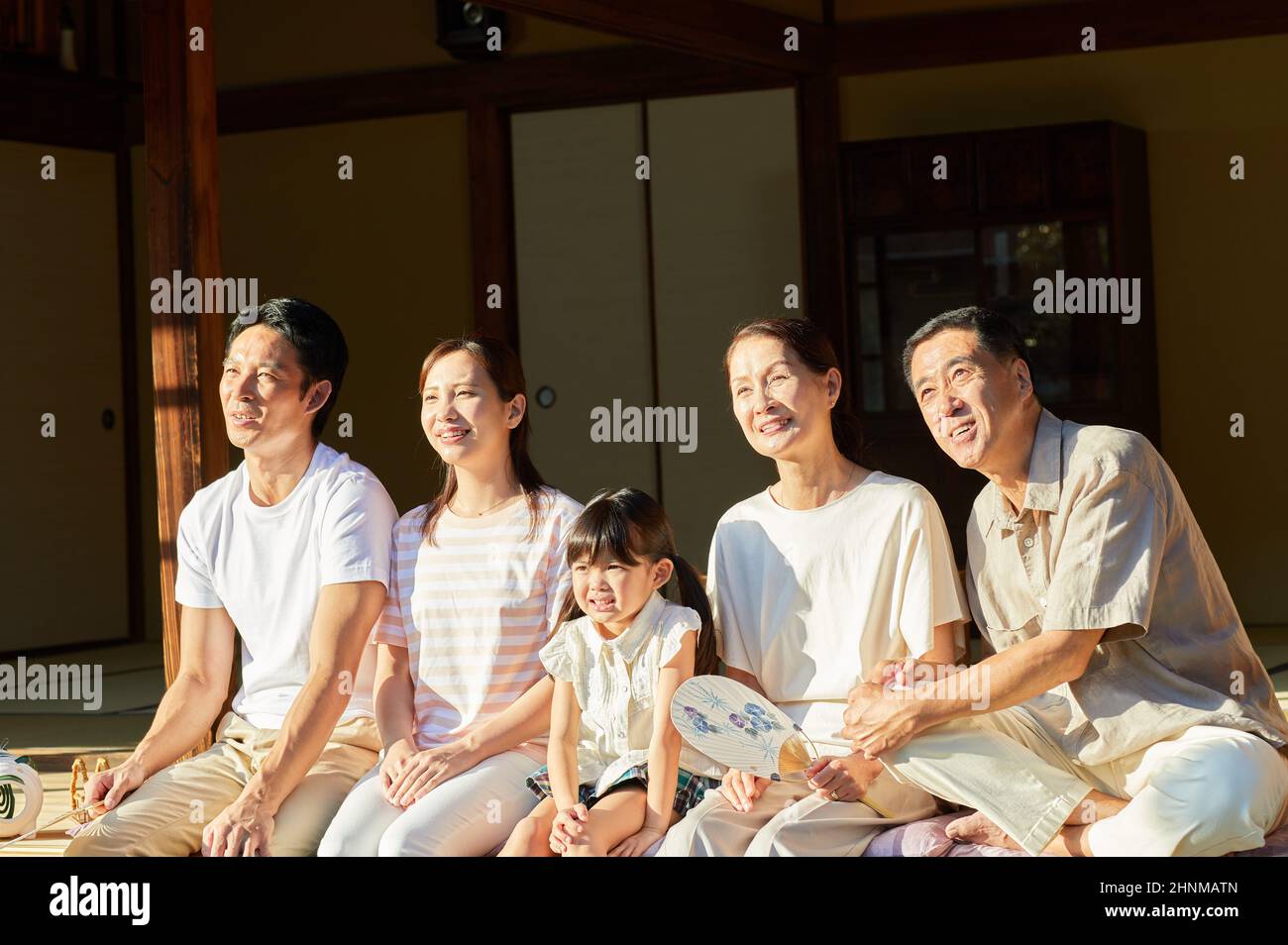 Three-Generations Japanese Family Sitting On The Porch Stock Photo - Alamy