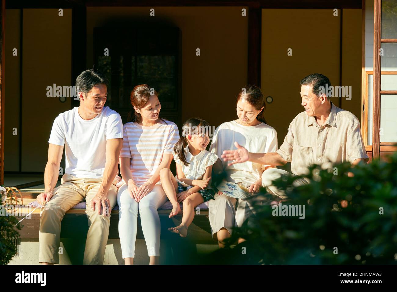 Three-Generations Japanese Family Sitting On The Porch Stock Photo - Alamy