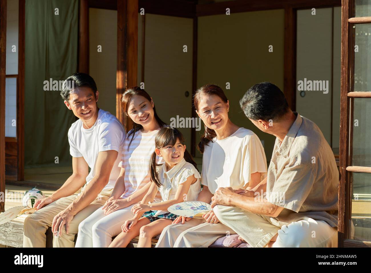 Three-Generations Japanese Family Sitting On The Porch Stock Photo - Alamy