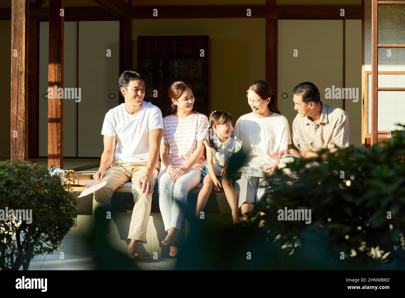 Three-Generations Japanese Family Sitting On The Porch Stock Photo - Alamy