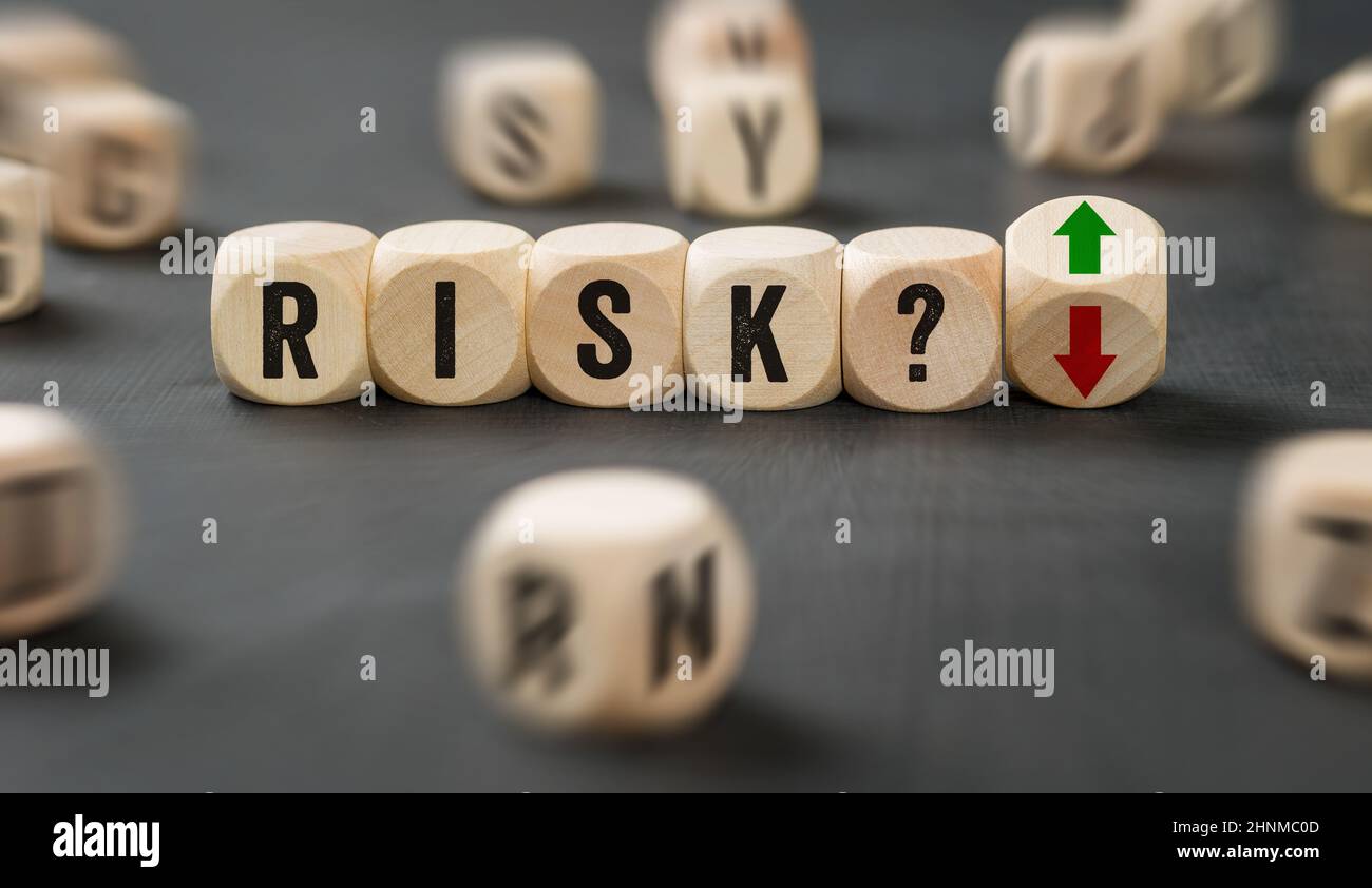 Letter dice with the word Risk Stock Photo - Alamy