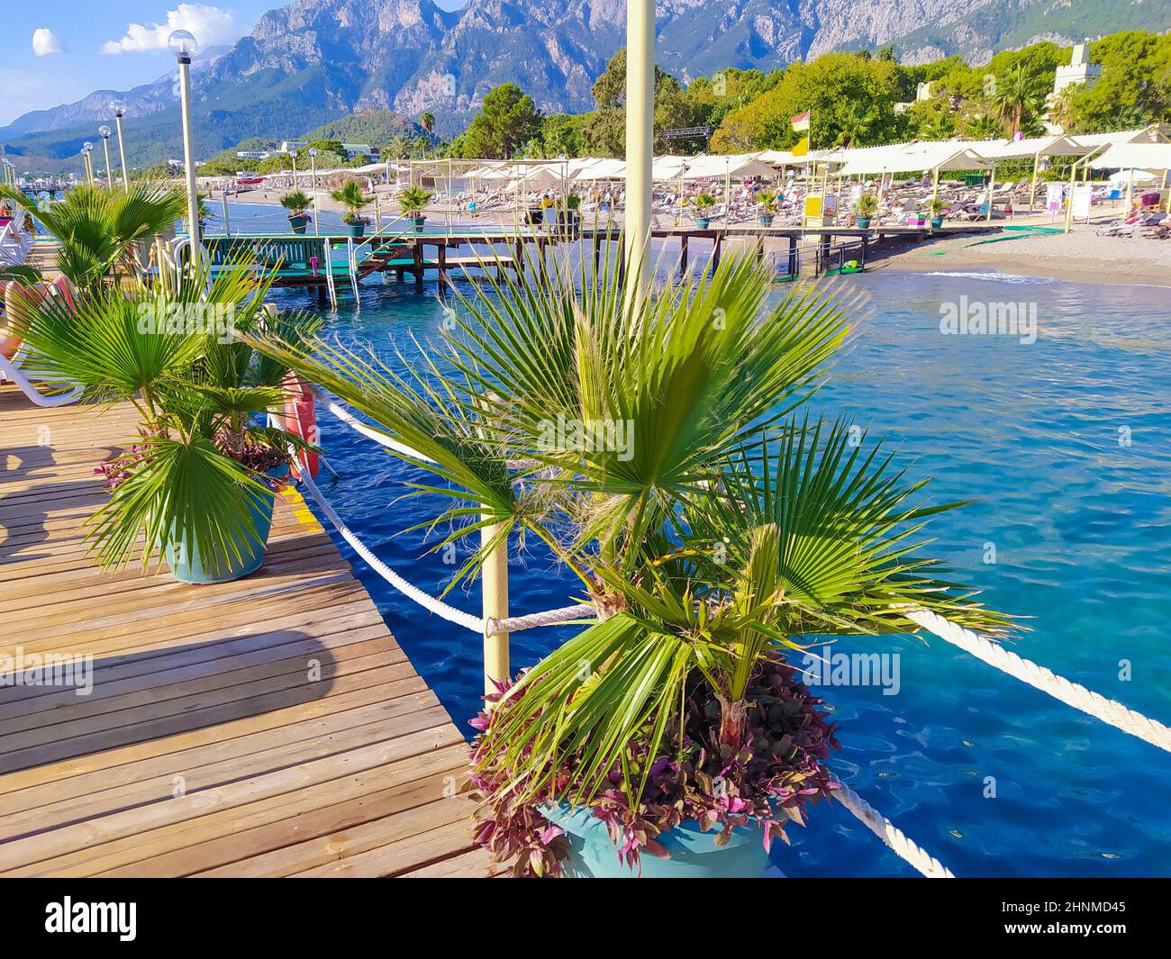 Sea coast with the resort piers and mountains at the background in ...
