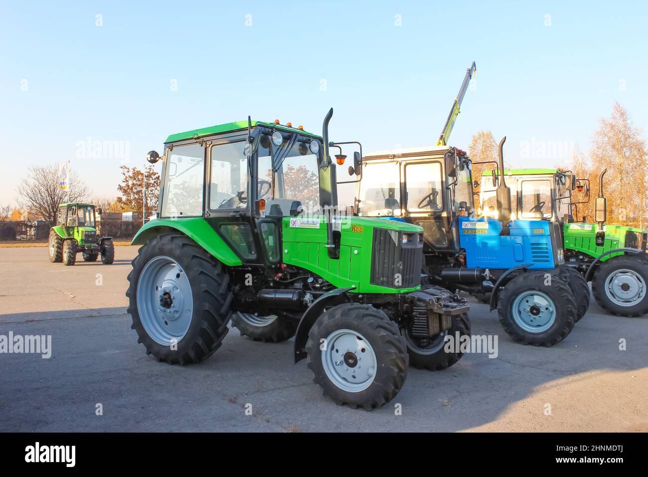 The colorful tractors in the road Stock Photo - Alamy