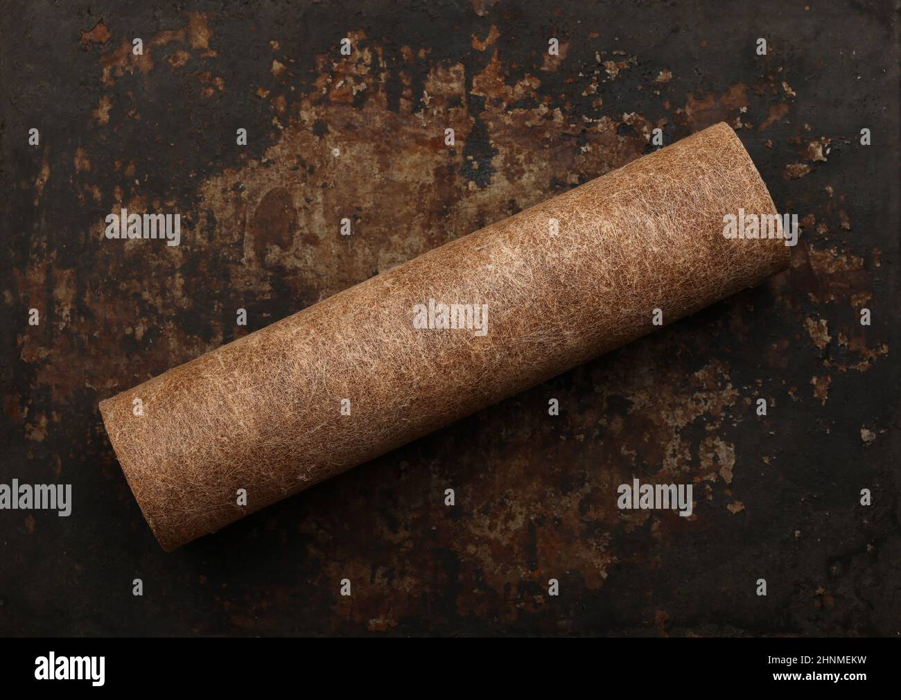 Close up one used dirty brown water purification filter with rust after ...