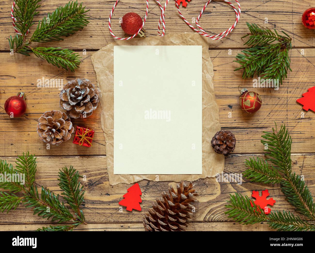 Winter Christmas Composition with a blank card over wooden table flat ...