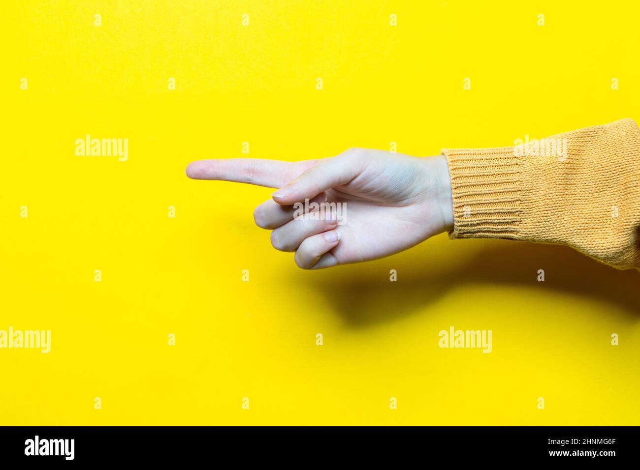 a woman's index finger pointing to the left Stock Photo - Alamy