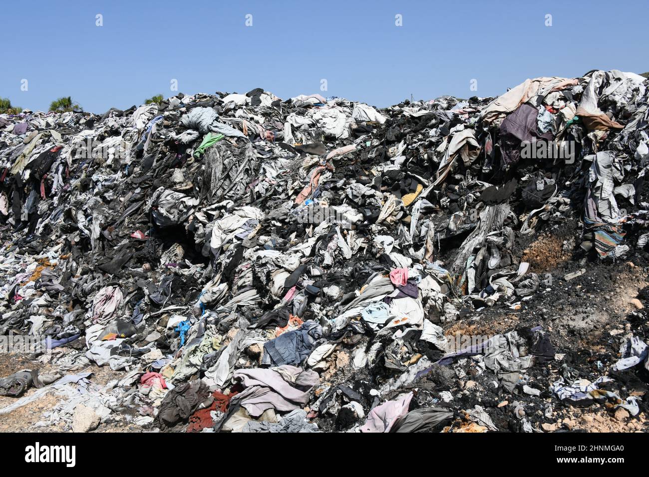 Burnt clothes on a bin in the province of Alicante, Costa Blanca, Spain ...