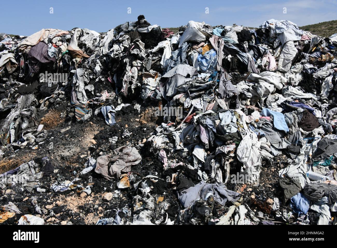 Burnt clothes on a bin in the province of Alicante, Costa Blanca, Spain ...