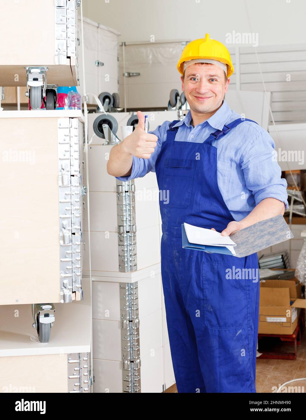 Construction worker inventorying tools and materials Stock Photo - Alamy