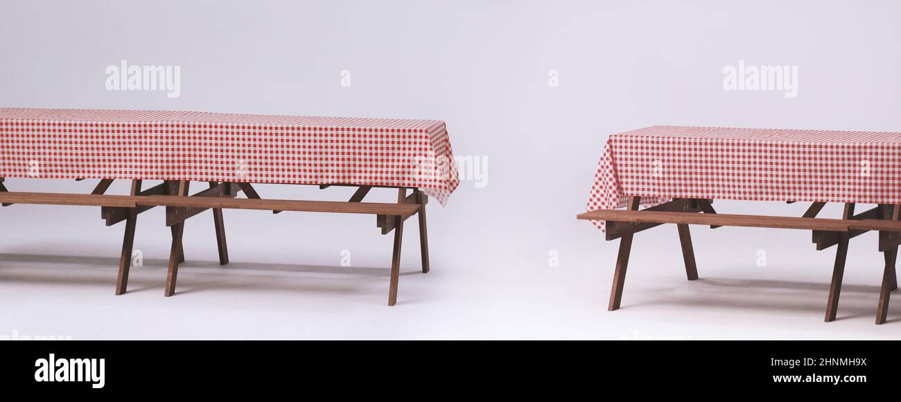 Picnic table and red checkered tablecloth with food and drink for ...
