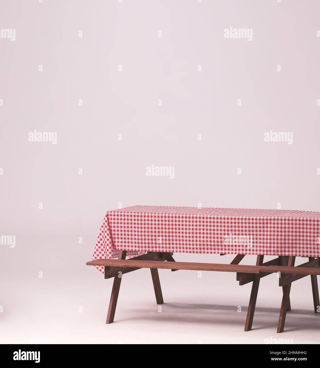 Picnic table and red checkered tablecloth with food and drink for ...