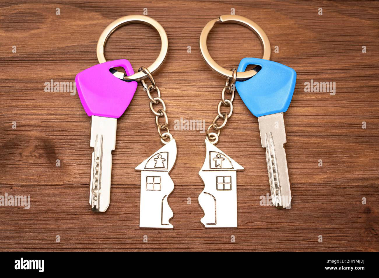 Blue and pink colored keys with split house matching keychains on a ...