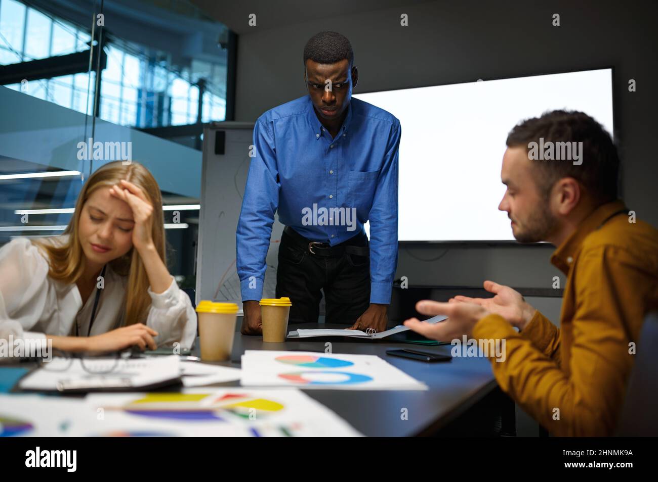 Team of managers at the table, conference in IT office. Professional ...