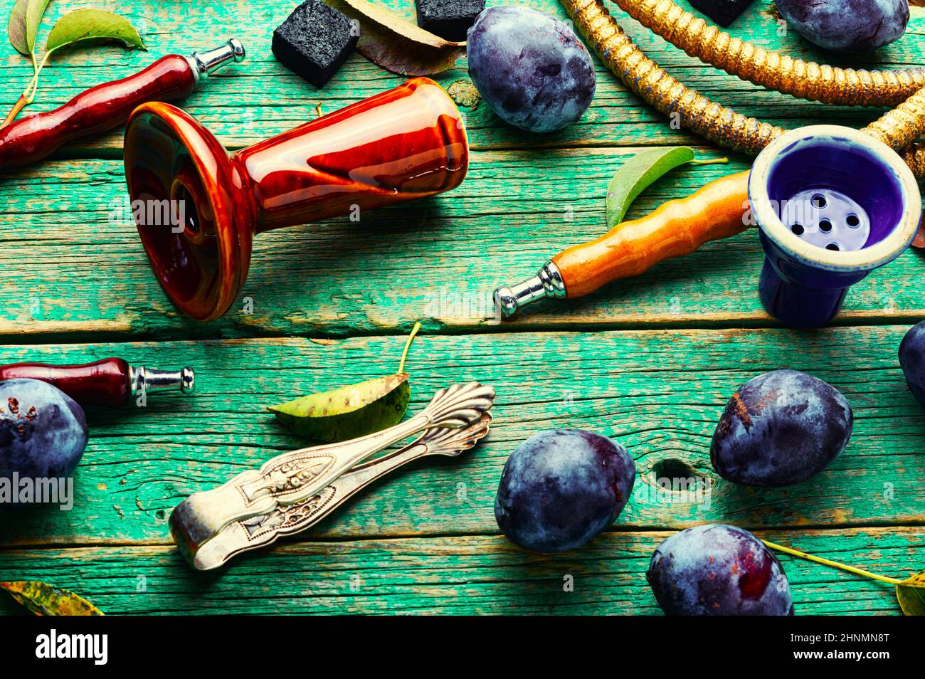 Smoking hookah with plum flavored tobacco.Fruit shisha Stock Photo - Alamy