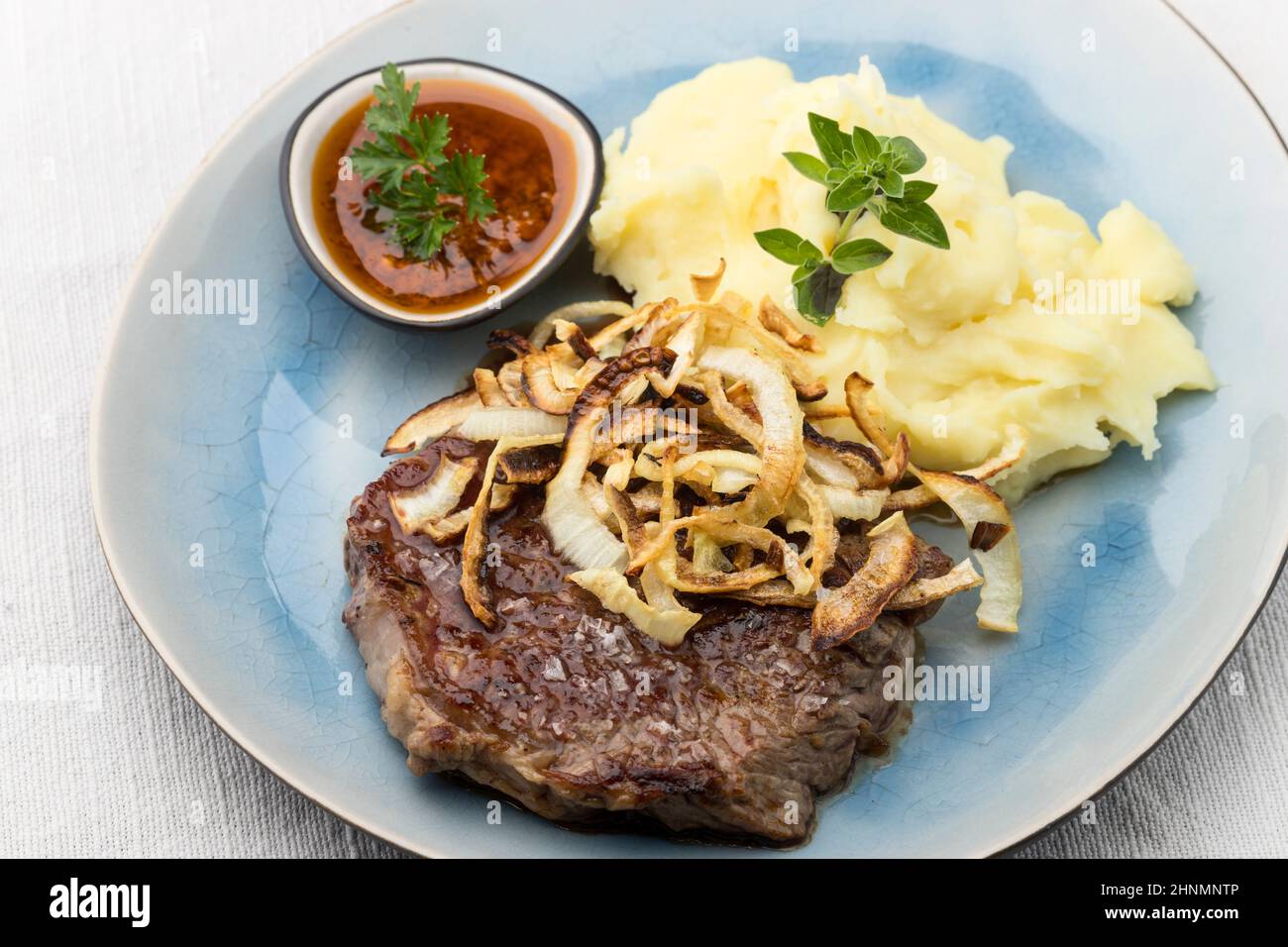 german steak with roasted onions Stock Photo - Alamy