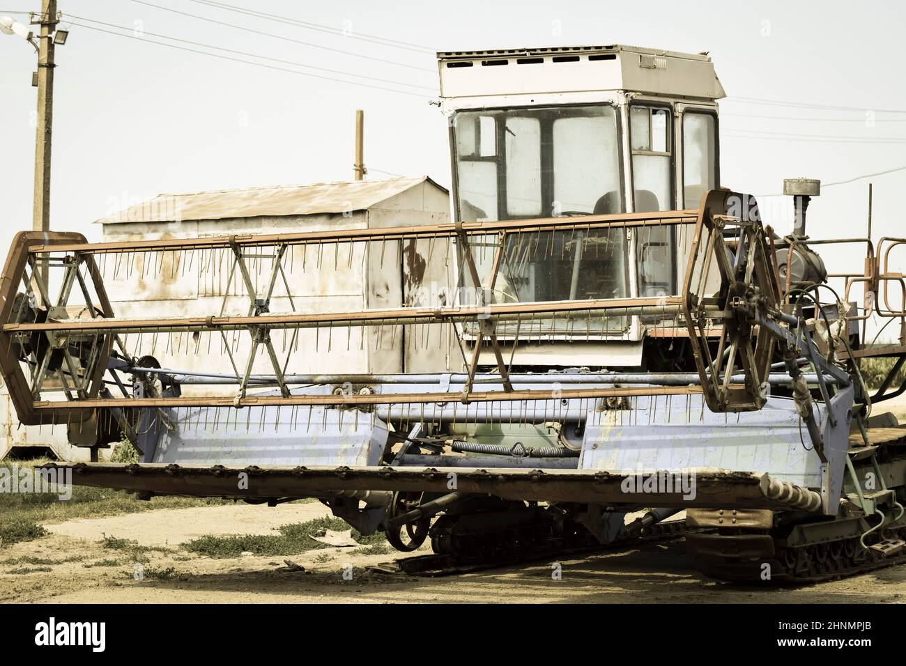 Rice header combine harvester Stock Photo - Alamy