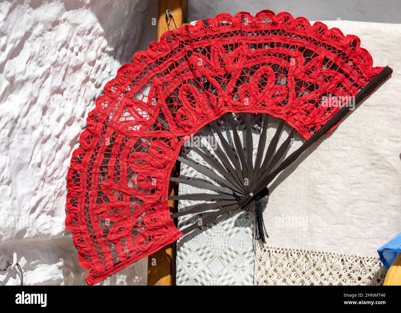 A red lace fan on display in a store in Alberobello Stock Photo - Alamy