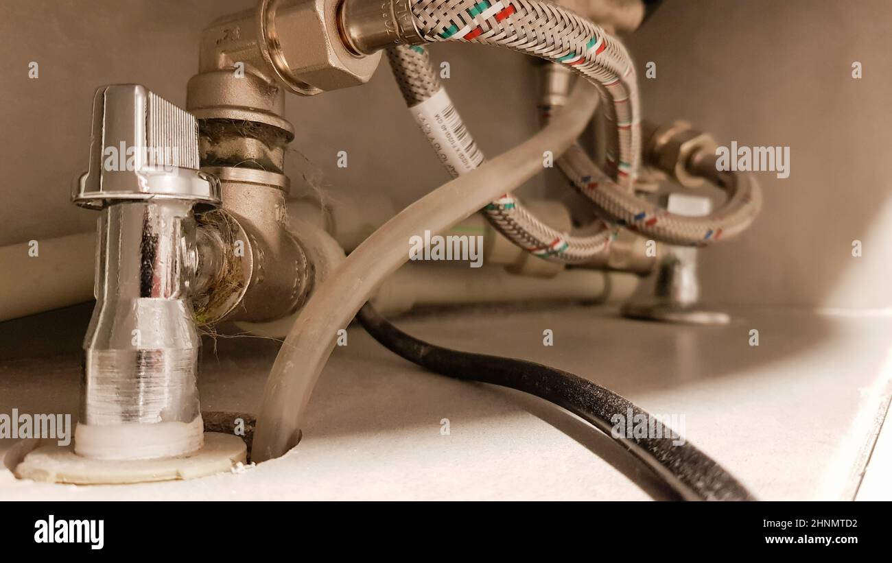 Connection of water supply, hot and cold water to the boiler. Hose for ...