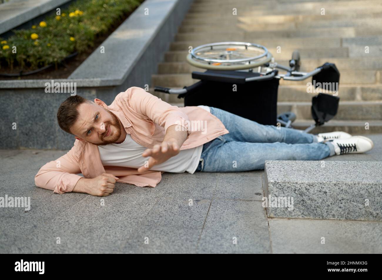 Alone disabled man fell out of a wheelchair, handicap problem ...