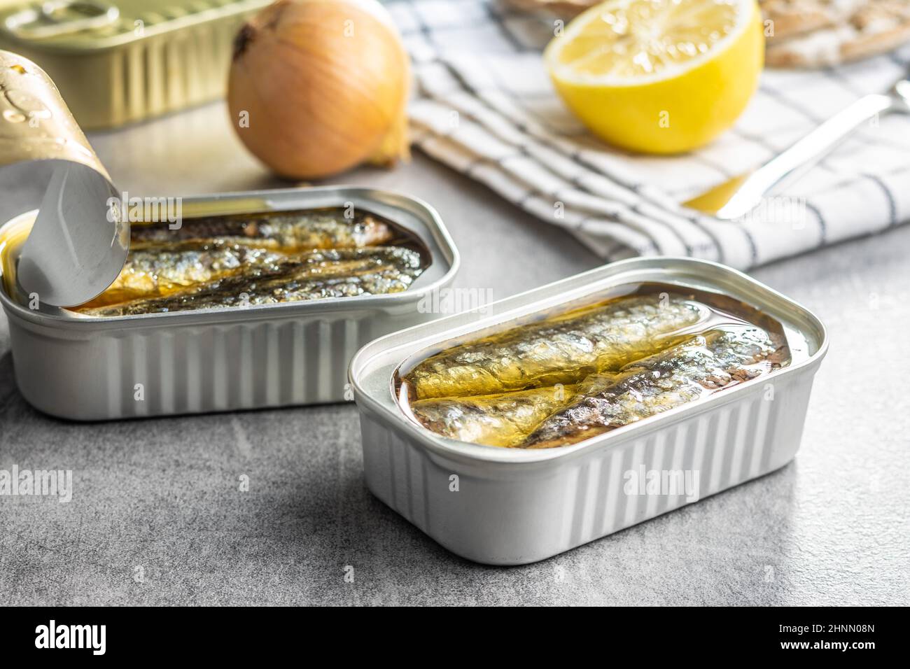 Canned sardines. Sea fish in tin can on kitchen table Stock Photo - Alamy