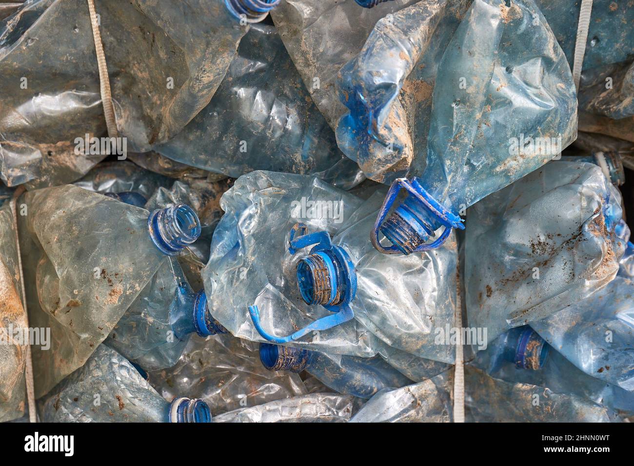Plastic waste pile, PET bottles collected into bales for recycling ...